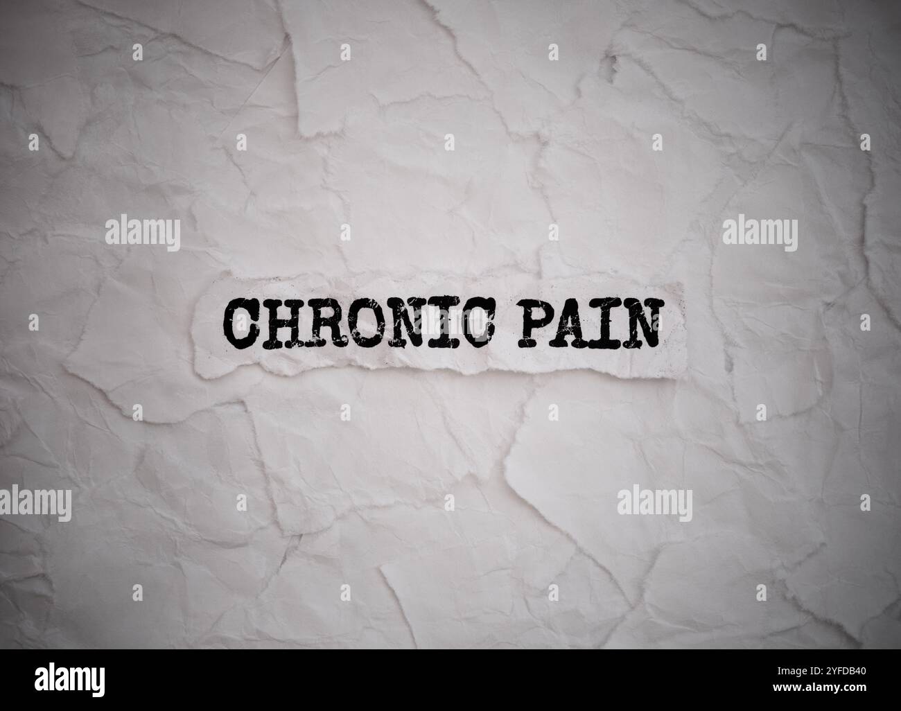 Crumpled piece of paper with words Chronic Pain on torn white paper ...