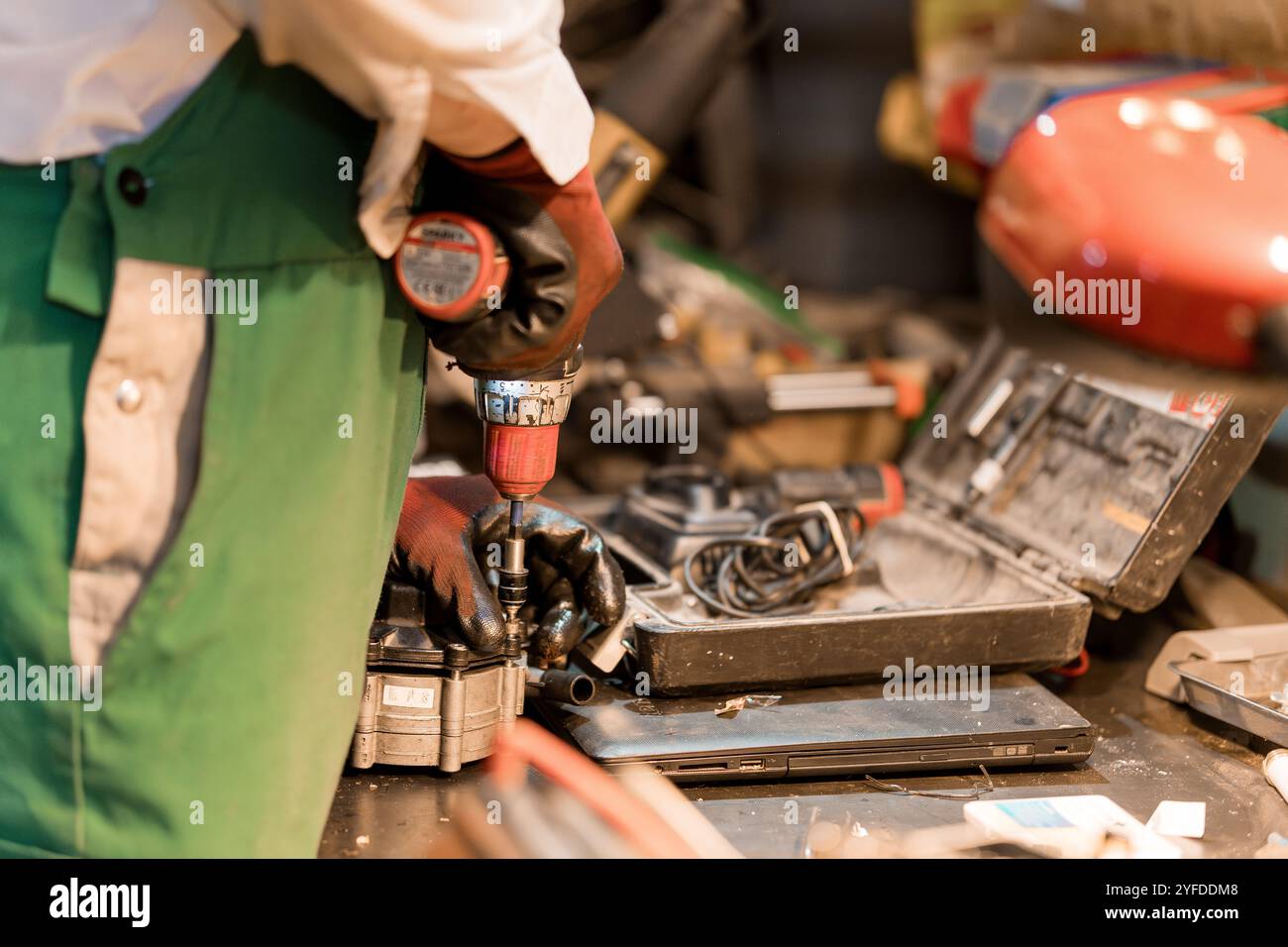 Mechanic Working on Equipment with Power Tools in a Workshop ...