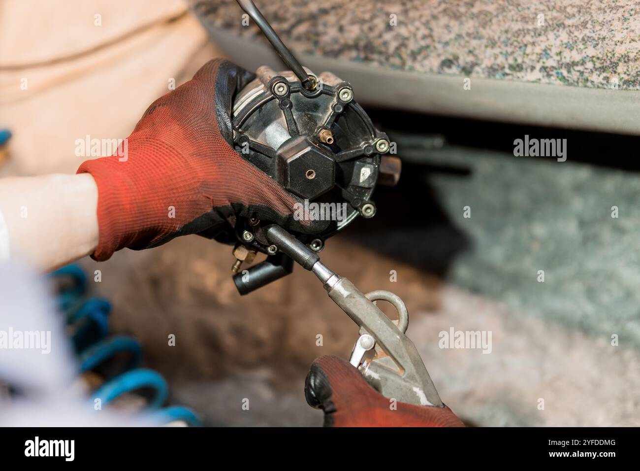 Precision Engineering in Action: A Technician Repairing a Motor ...