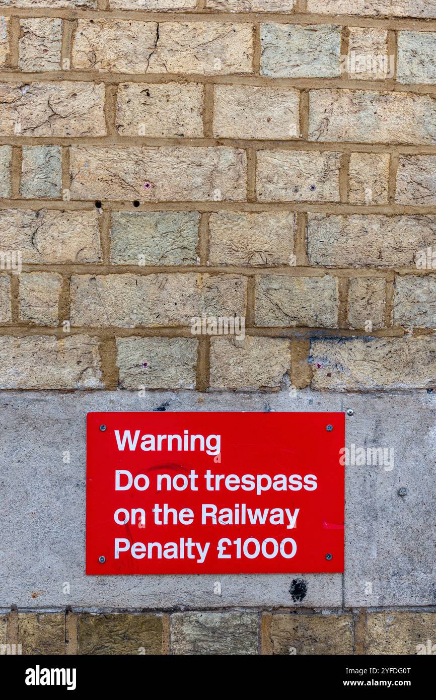 A tresspass and penalty warning sign at Cambridge Train Station ...