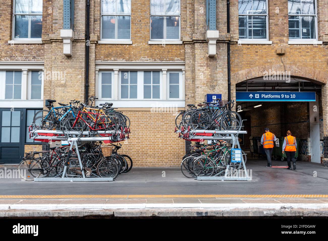 A busy full two tier bike rack at Kings Cross Train Station, London, England, UK Stock Photo - Alamy