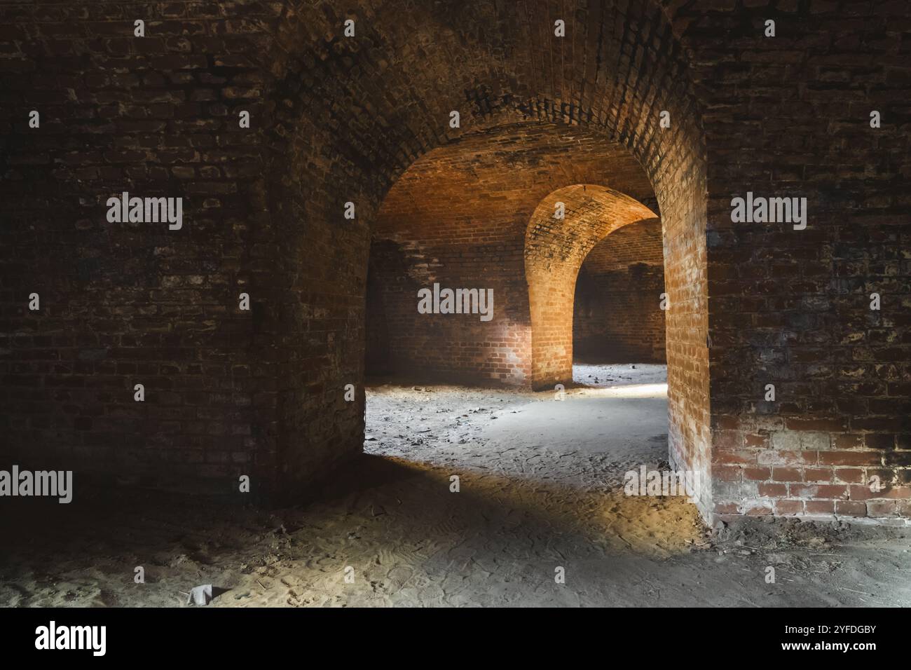 Brick walls and arches in the Bobruisk fortress. Sunlight inside the ...