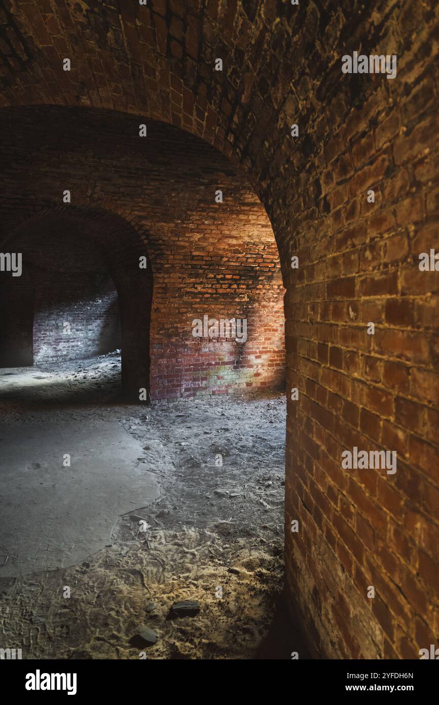 Brick walls and arches in the Bobruisk fortress. Sunlight inside the ...