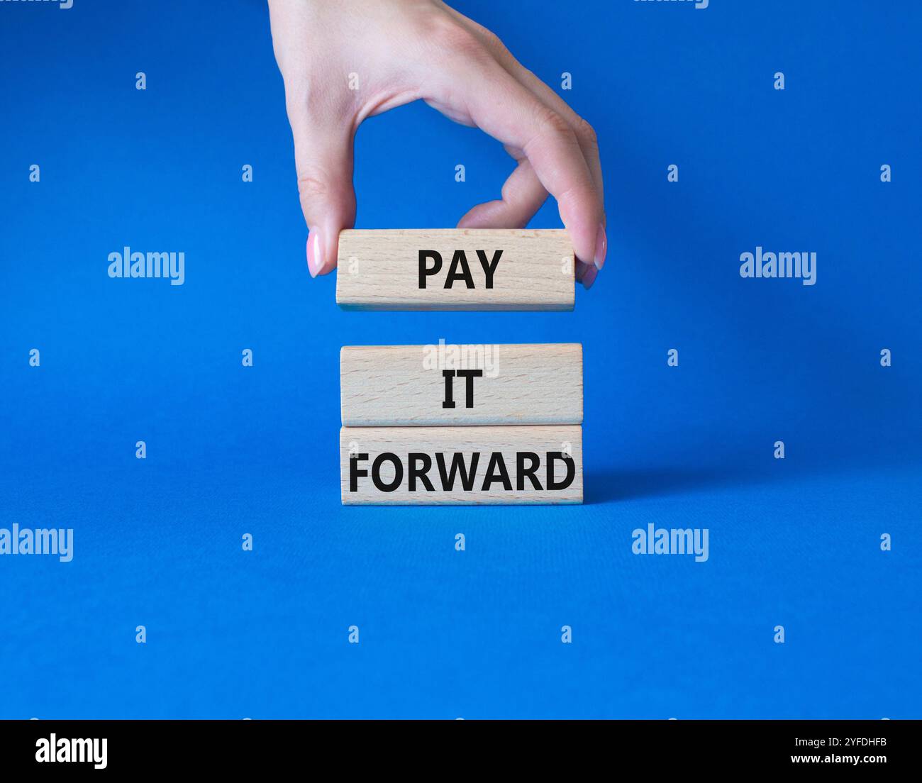 Pay it forward symbol. Concept words Pay it forward on wooden blocks ...
