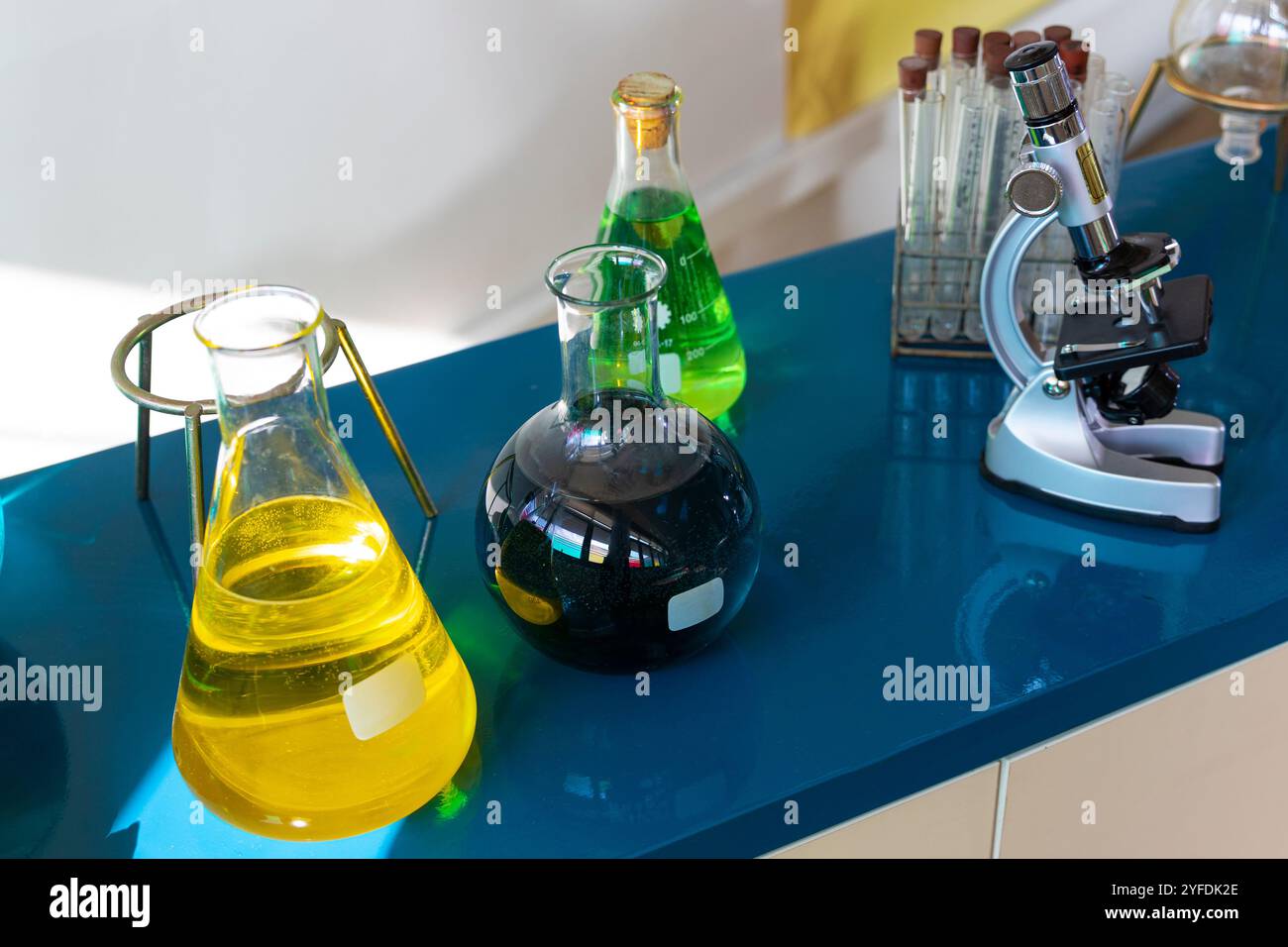 A close-up view of a laboratory setup featuring colorful chemical ...