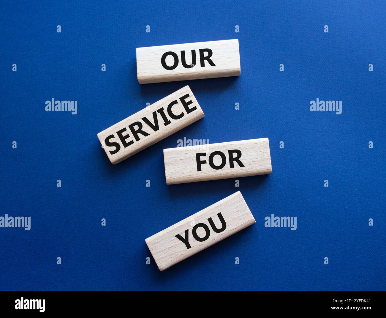Our service for you symbol. Wooden blocks with words Our service for ...
