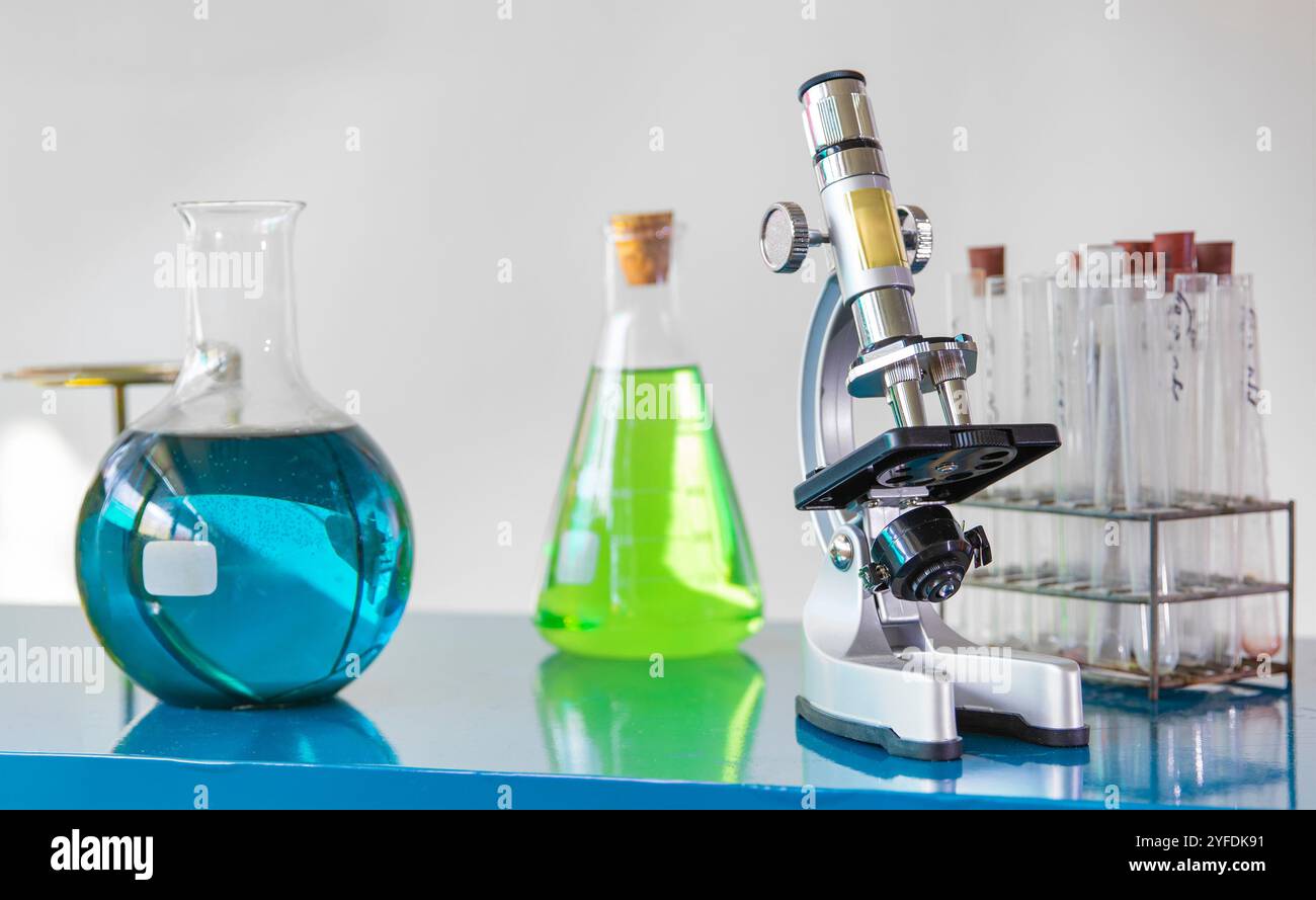 A close-up view of a laboratory setup featuring colorful chemical ...