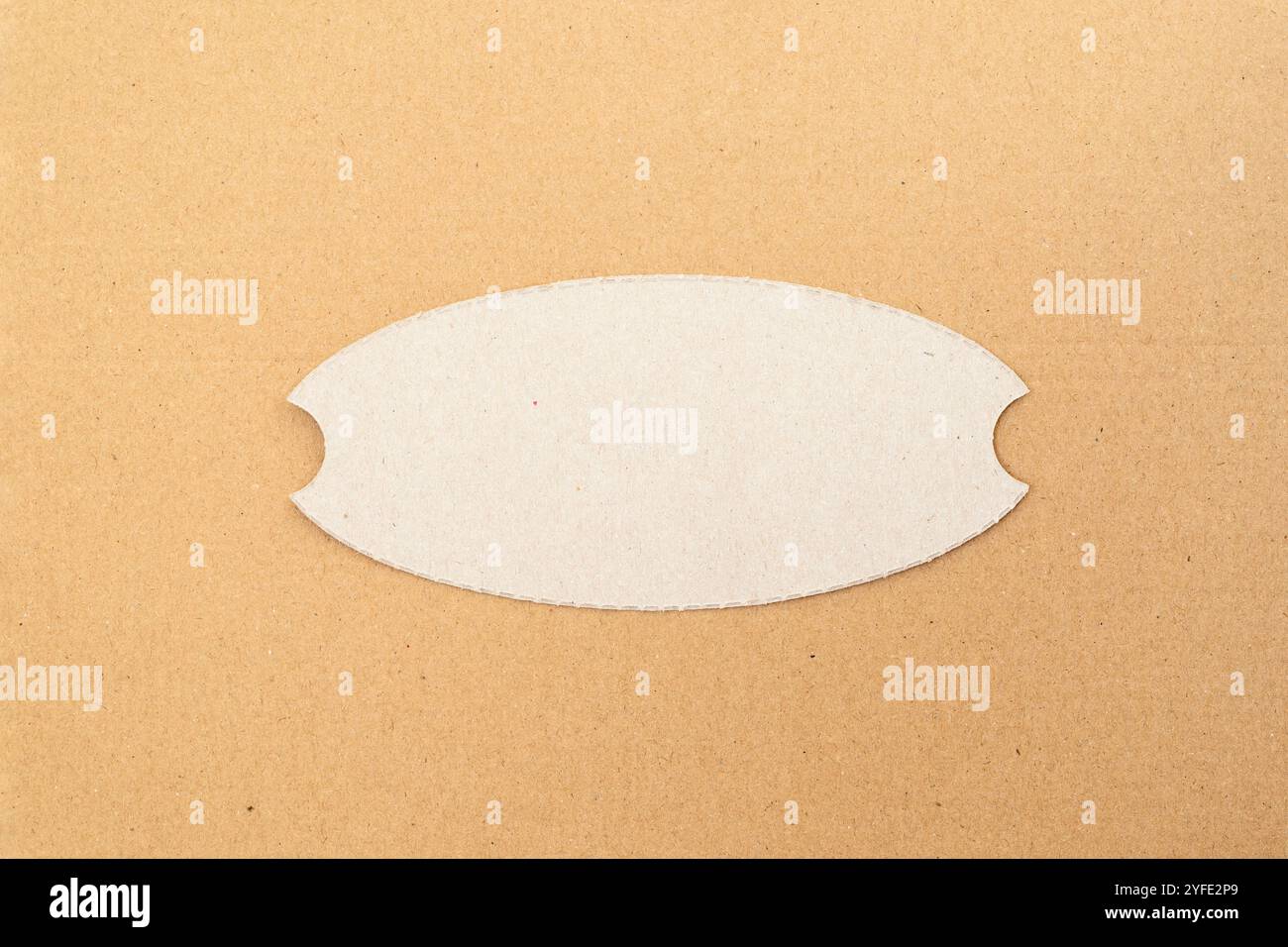 Cardboard label cutout on a cardboard background Stock Photo - Alamy
