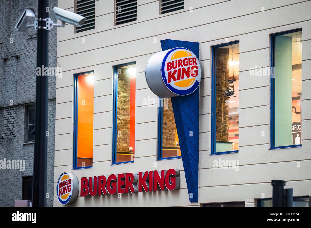 Burger King storefront in New York City with illuminated signs and ...