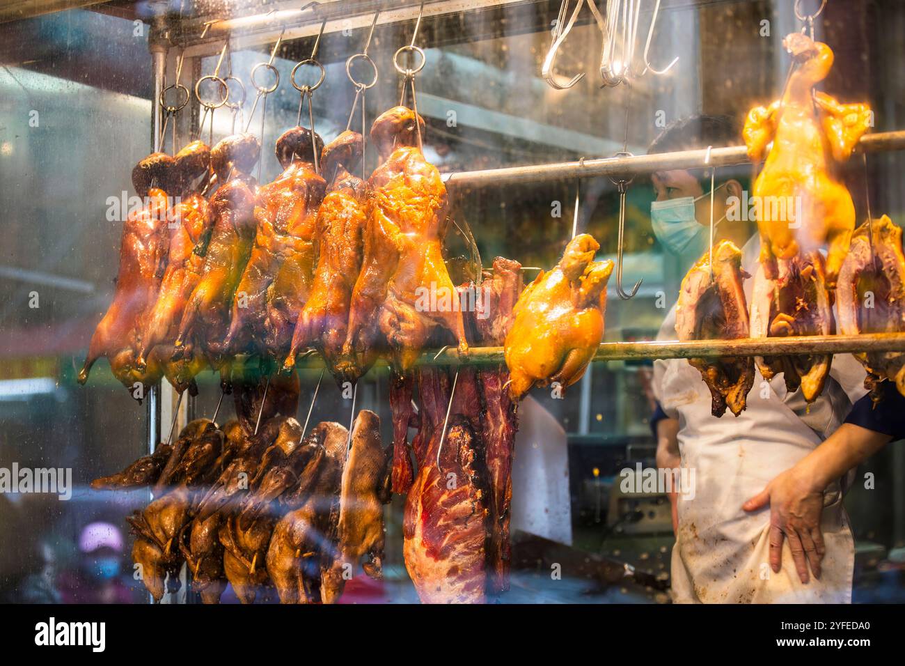 Cooked chickens on display at a local food market in Chinatown New York ...