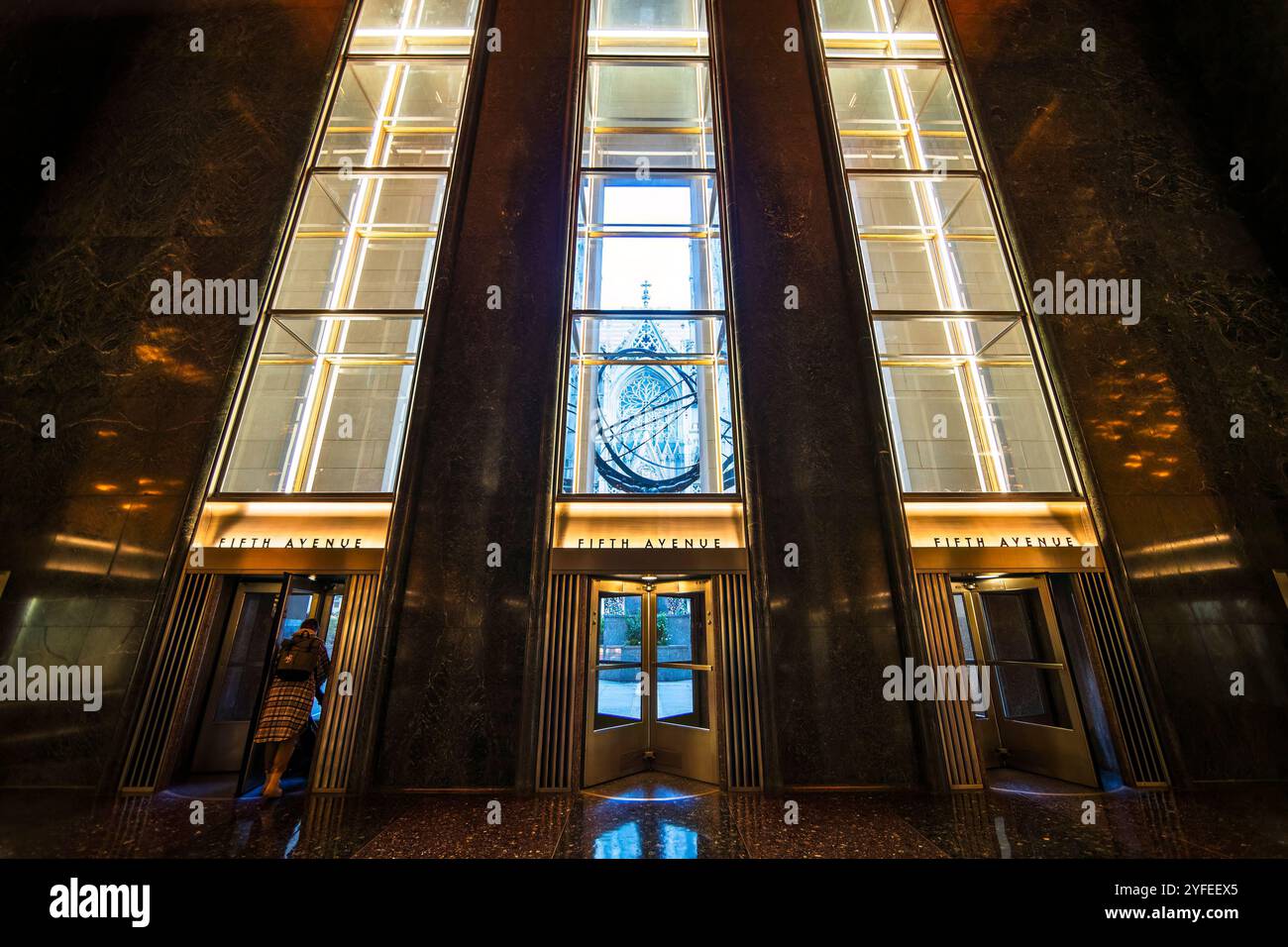 The illuminated entrance of Rockefeller Plaza in New York City ...