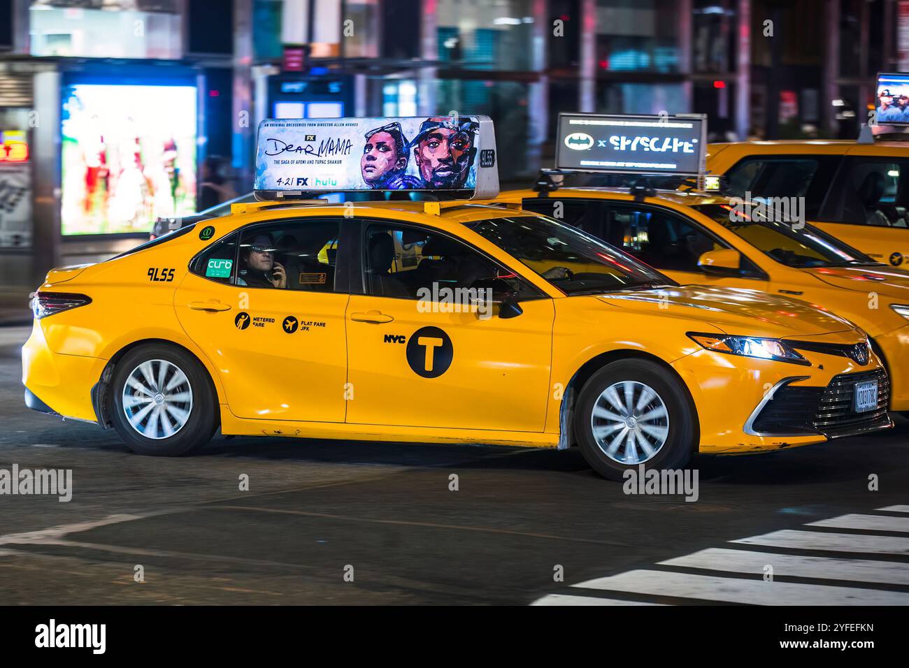 Yellow taxi car Toyota Camry in a city street Stock Photo - Alamy