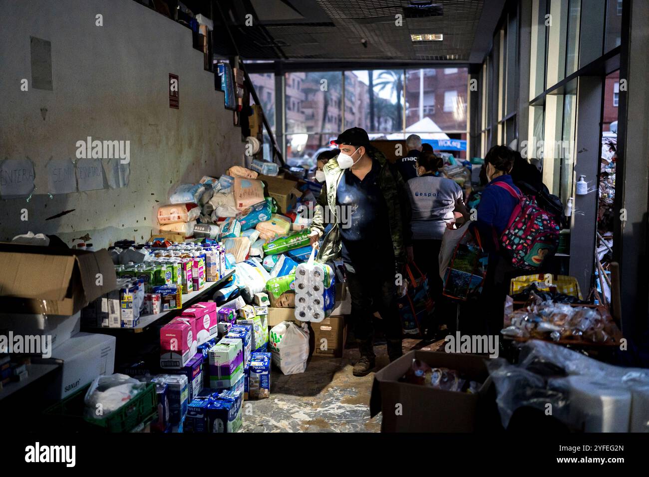 Volunteers organize donations on November 4, 2024, in Paiporta ...