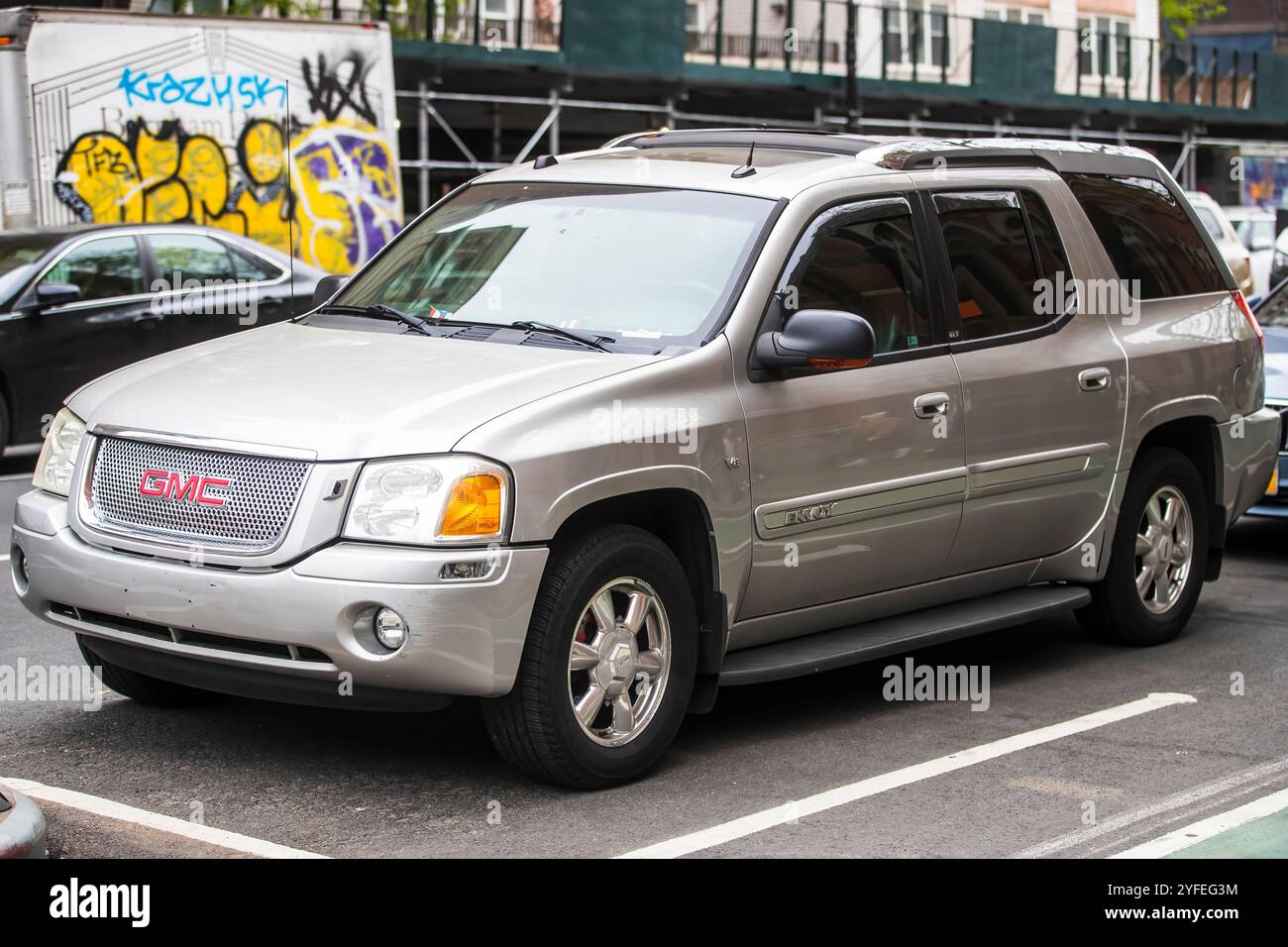 Silver GMC SUV parked on a New York City street Stock Photo - Alamy