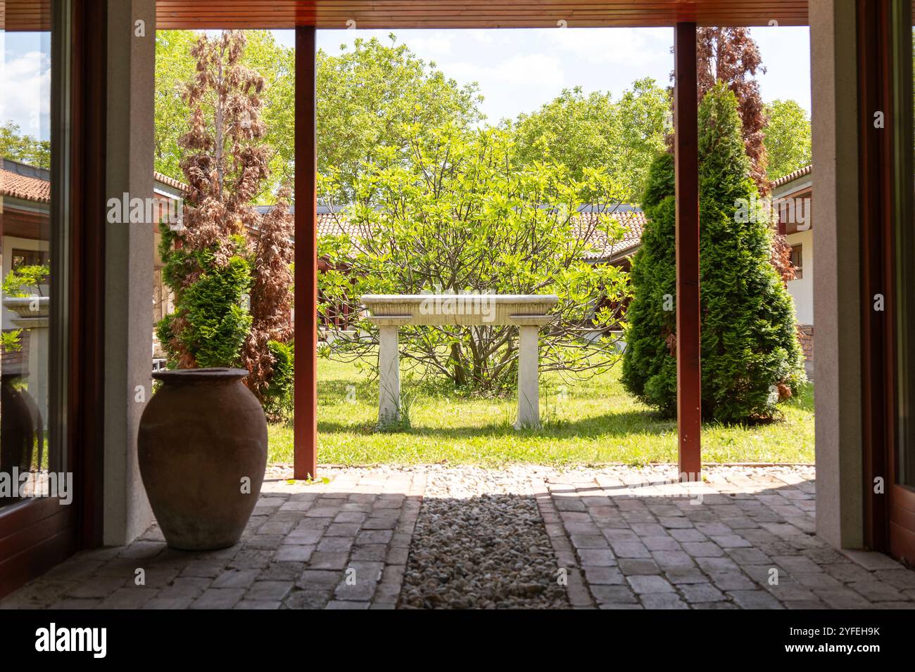 Inner courtyard of an ancient Roman villa with an old stone home altar ...