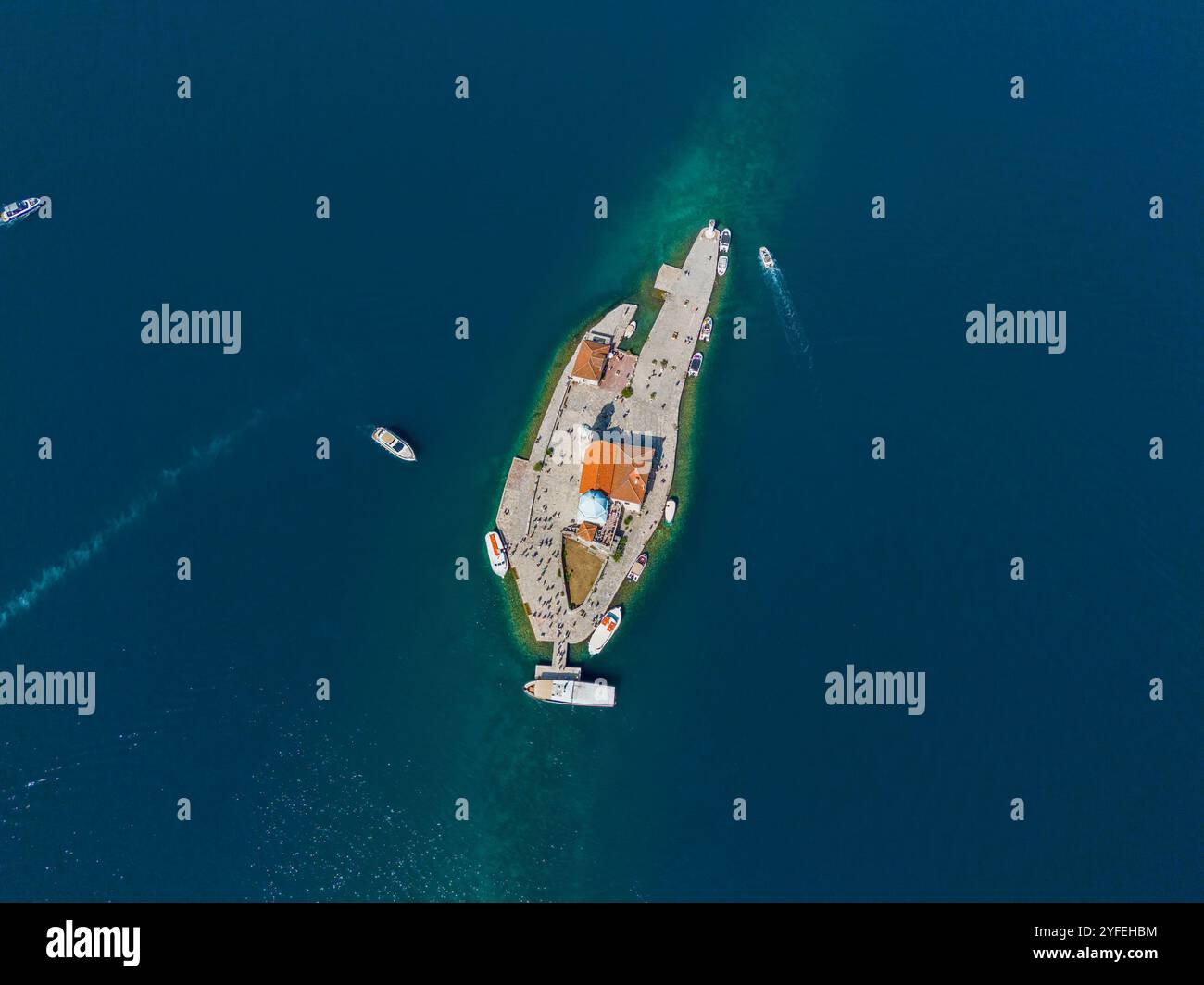 Aerial view of the historic Church of Our Lady of the Rocks on a small ...