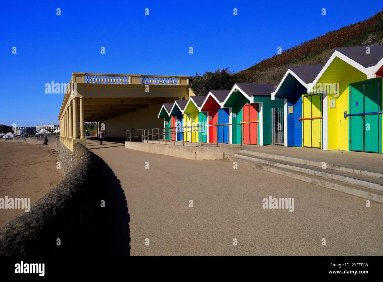 Multi coloured painted wooden beach huts at Barry Island seaside resort ...
