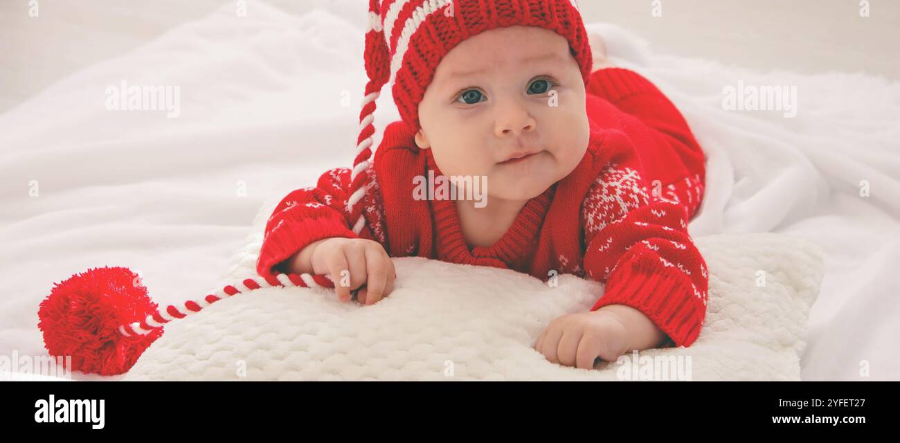 Baby dressed as Santa Claus Stock Photo - Alamy