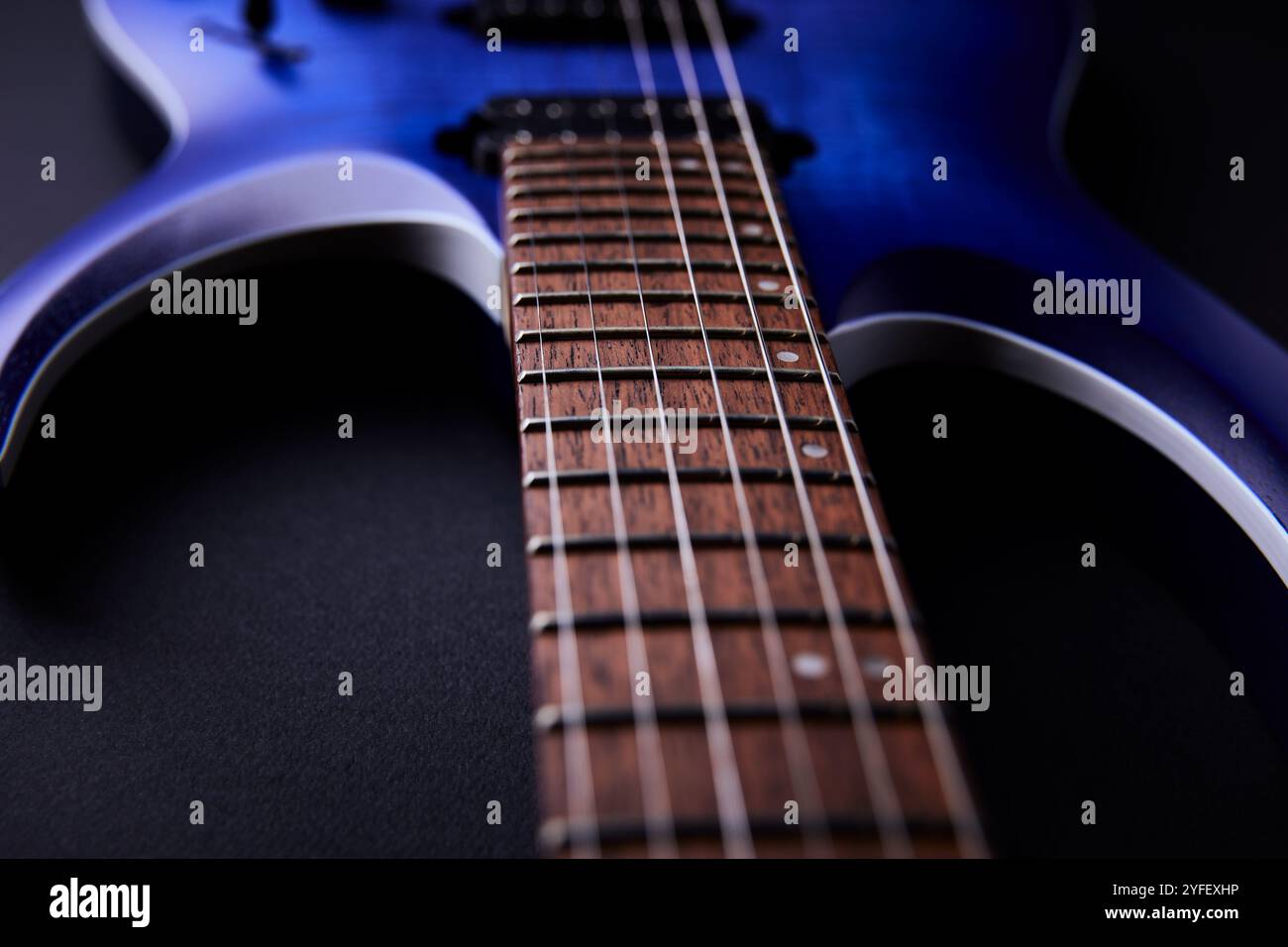 Fretboard of modern electric guitar. Close up Stock Photo - Alamy