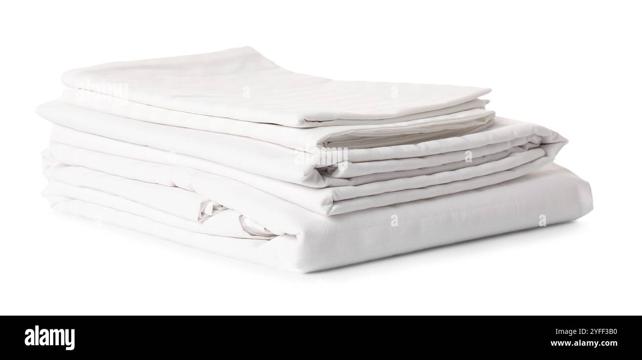 Stacked clean bed linens on white background Stock Photo - Alamy