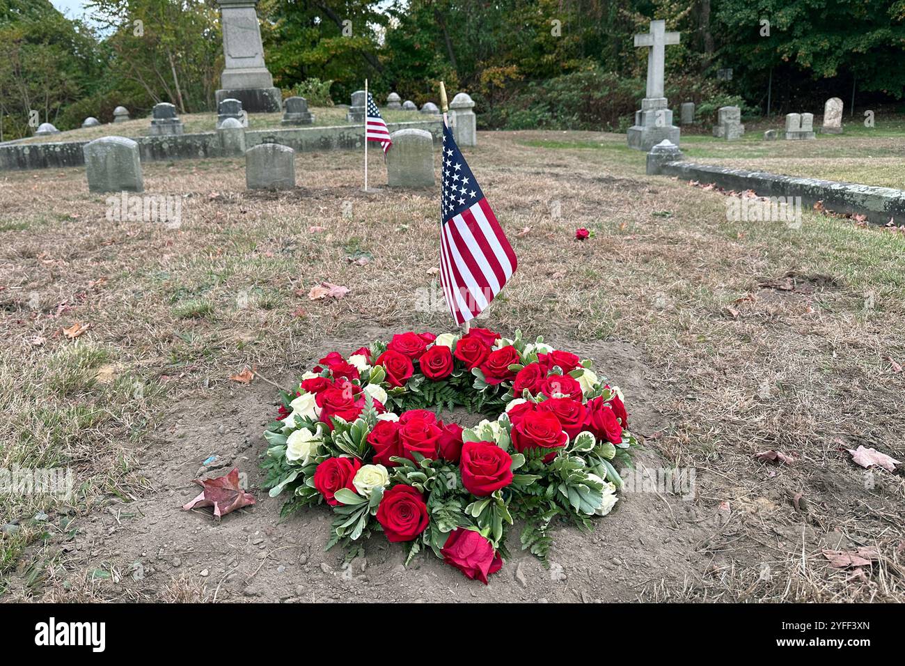 Flowers rest Thursday, Oct. 17, 2024 on the grave of Byron R. Johnson ...