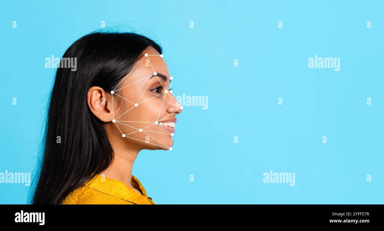Profile view of a woman with facial recognition overlay against blue ...
