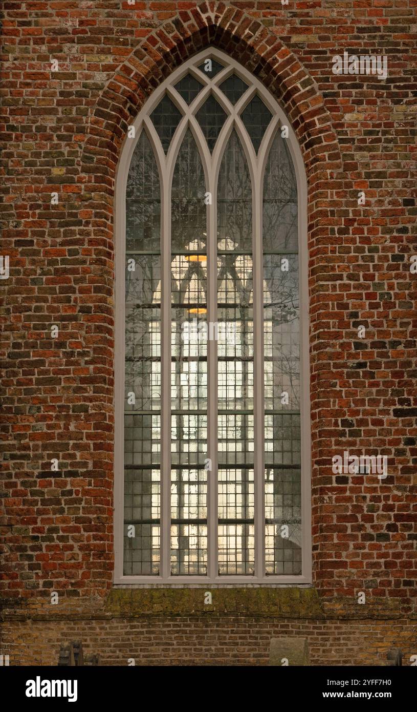 Gothic windows in brick wall of historic church of Hollum on the Dutch ...