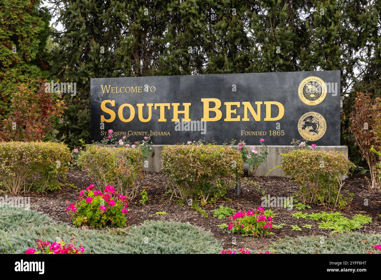 A Welcome to South Bend, Indiana sign surrounded by beautiful ...