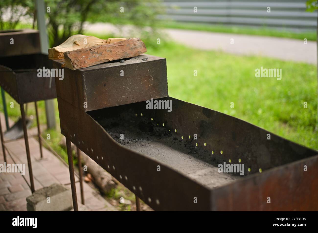 the barbecue area. an old rusty grill Stock Photo - Alamy