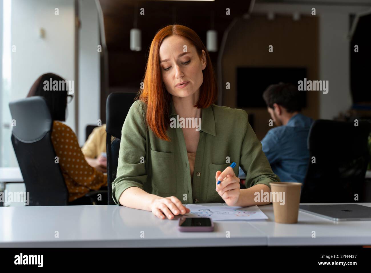 Reviewing colleagues analyzing documents hi-res stock photography and ...