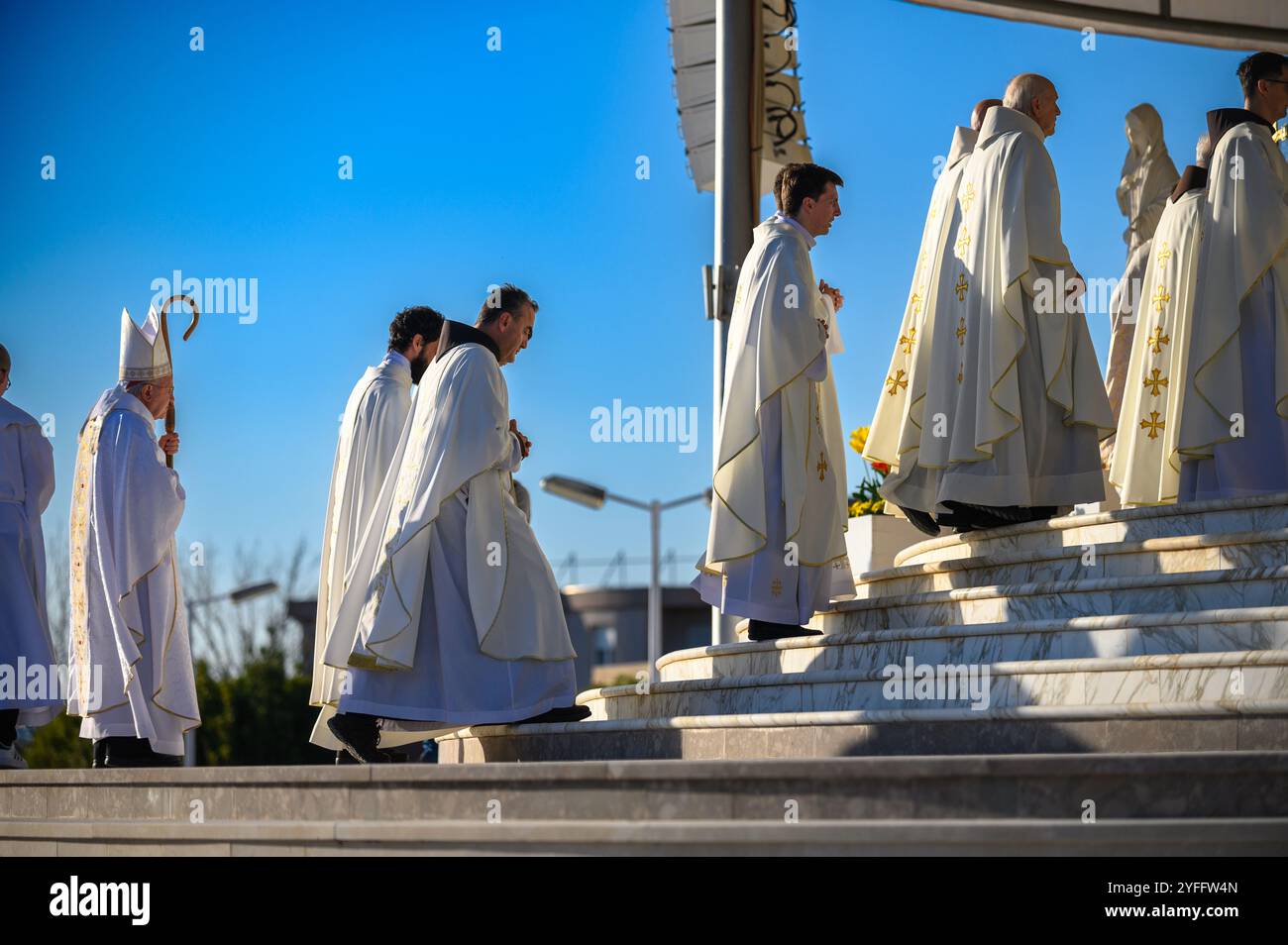 The entrance of the clergy during Holy Mass celebrated by Archbishop ...