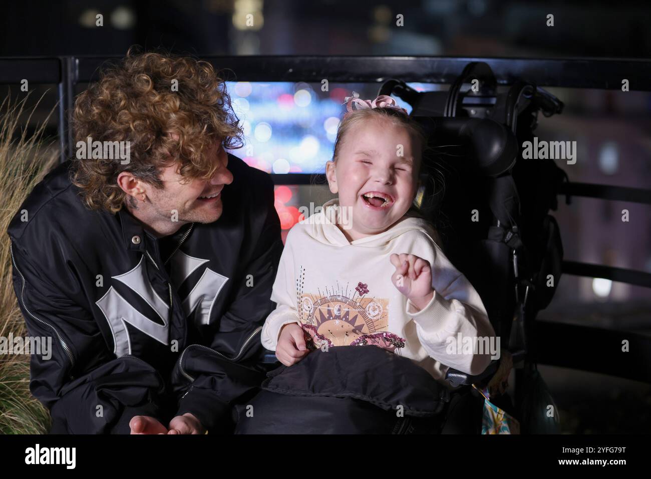 EDITORIAL USE ONLY Tom Grennan and 7-year-old Emily Mullen after ...