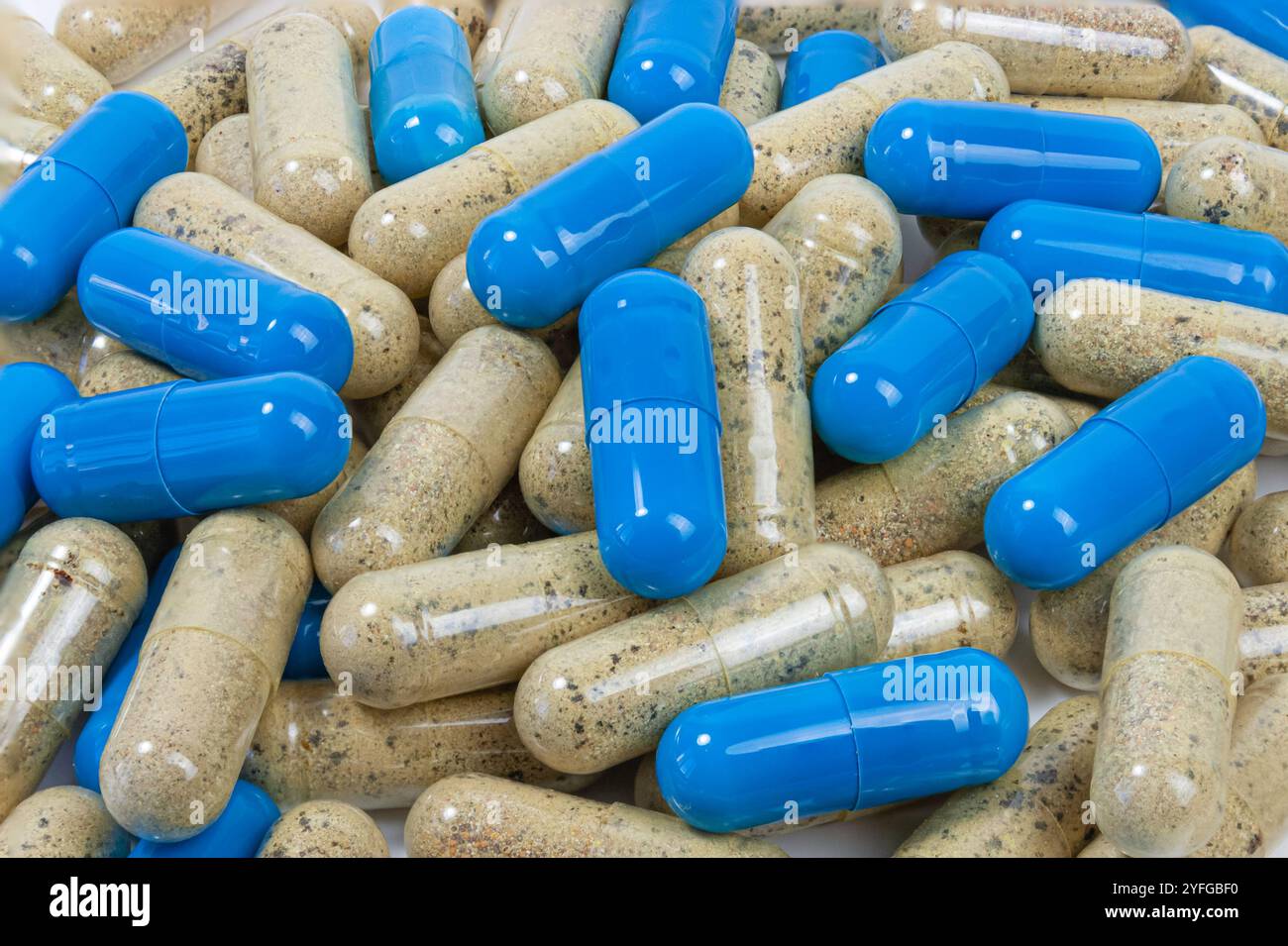 A high-resolution close-up image of assorted capsules, featuring a mix ...