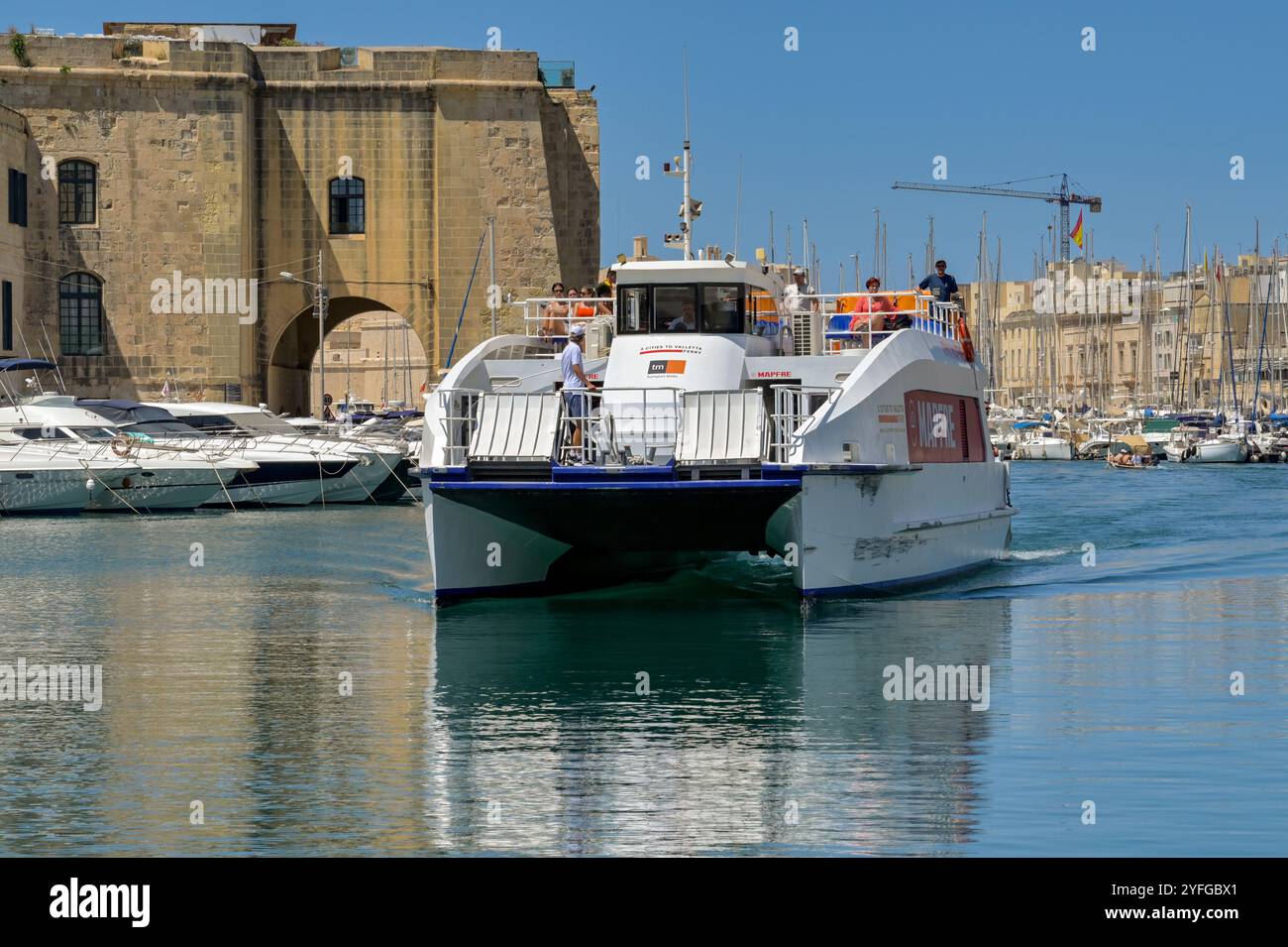 Valletta, Malta - 6 August 2023: Passenger ferry service operated by ...