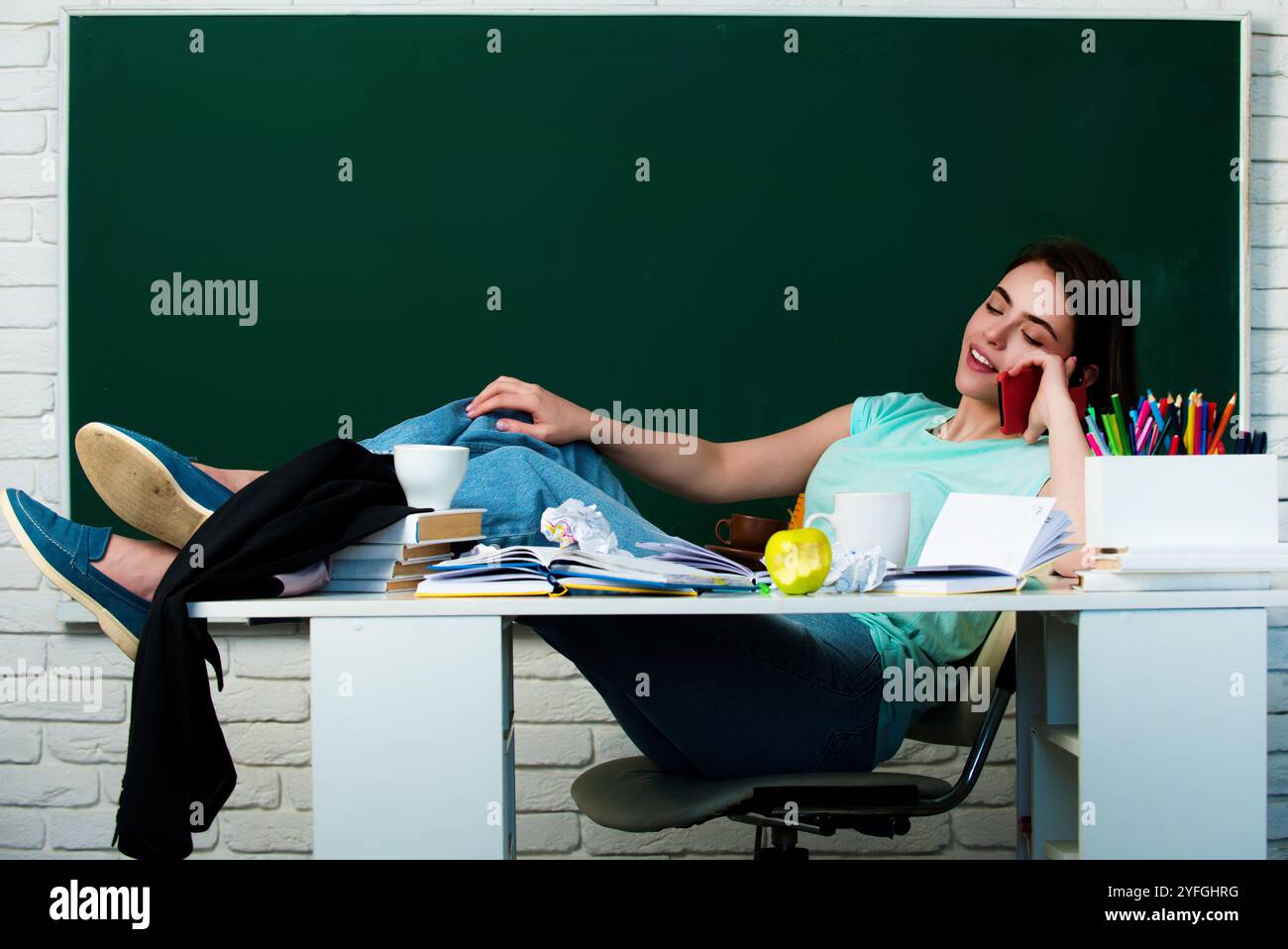 Bad girl student. School break. Student chatting on phone during School ...