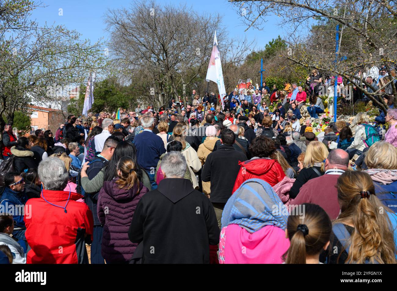 A crowd praying at the Blue Cross [one of the places of apparitions] at ...