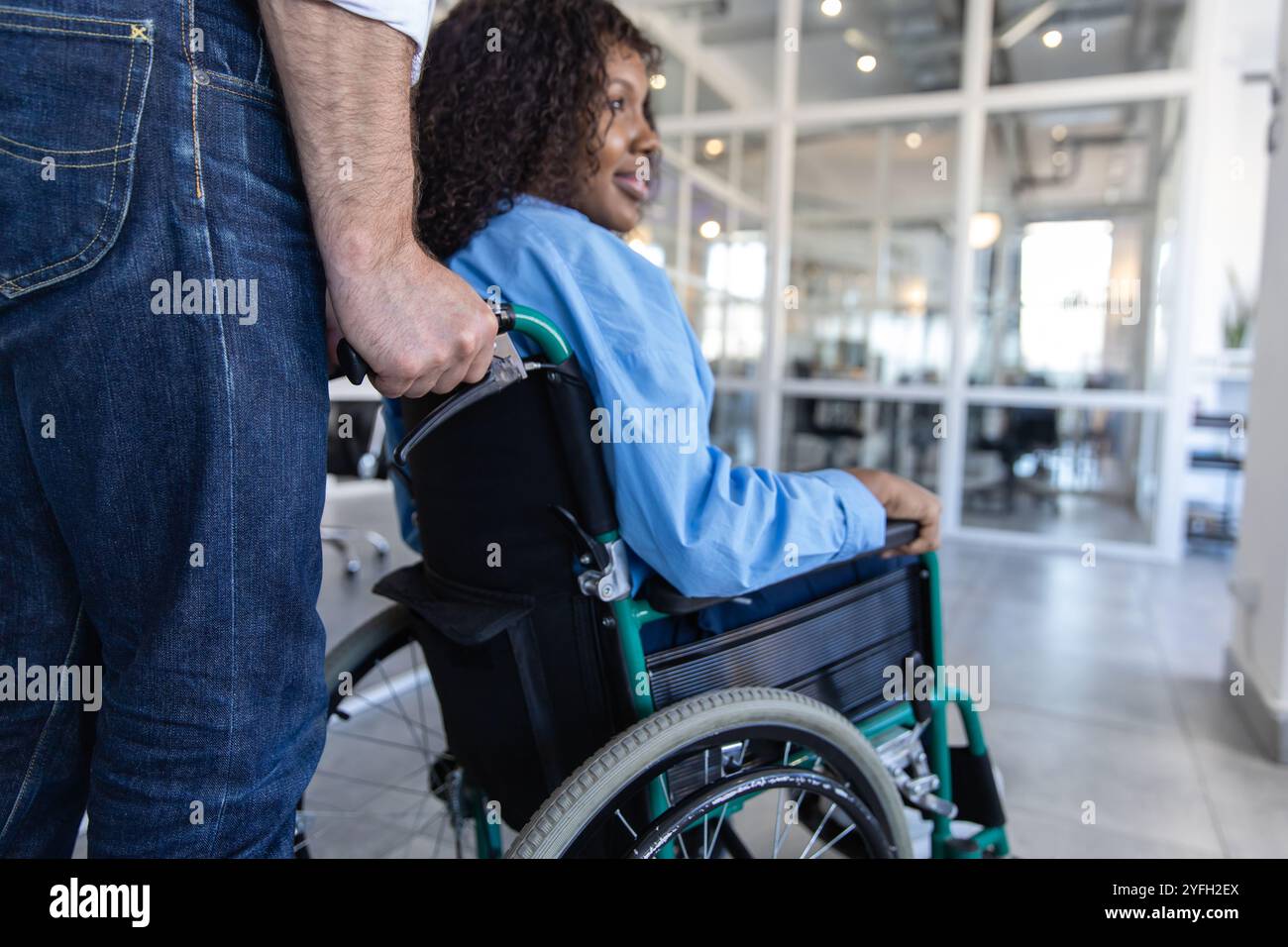 Woman in wheelchair managing her job despite her disability posing in ...