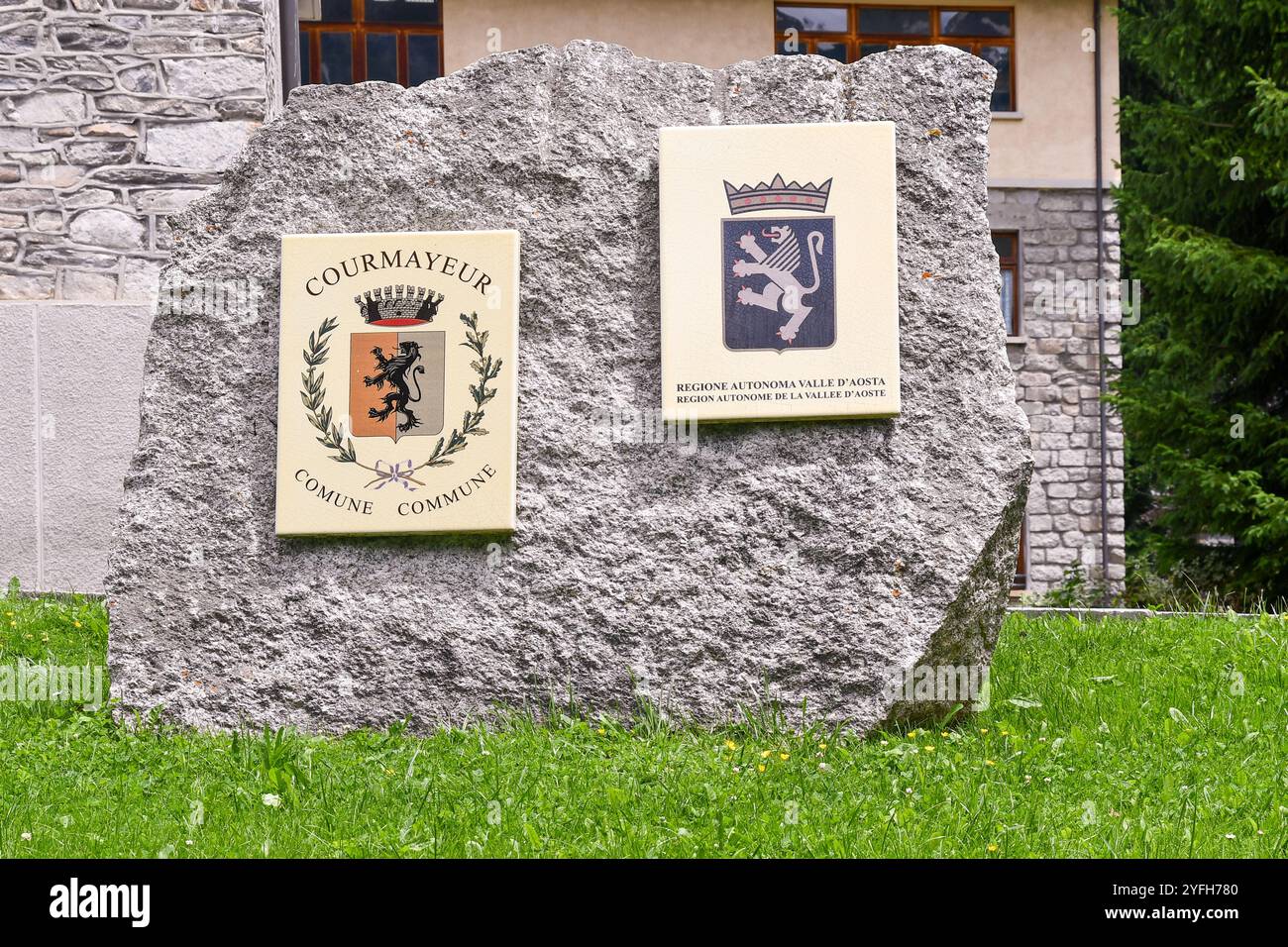 The coat of arms of Courmayeur and the Aosta Valley region on a rock in ...