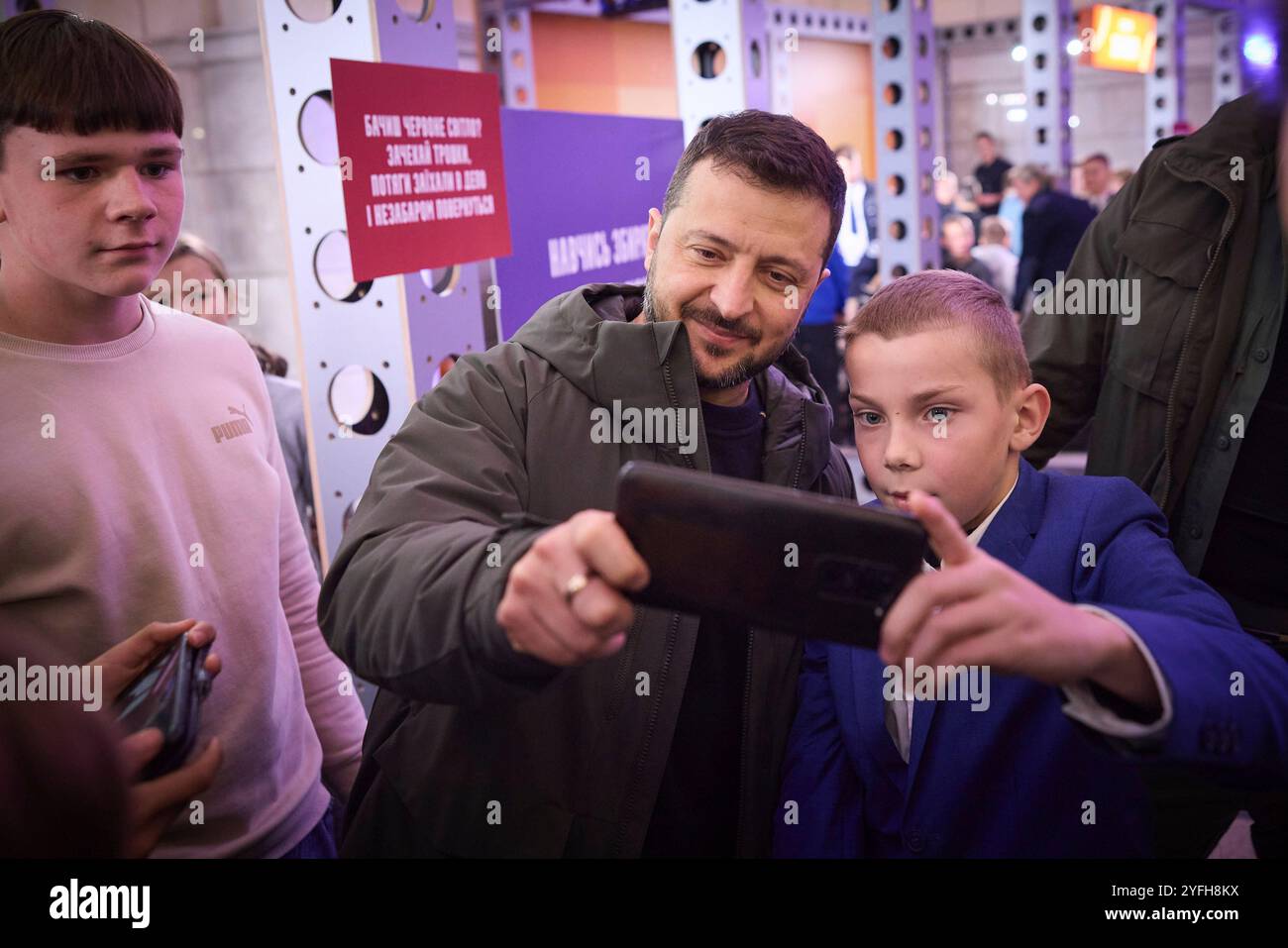 Kiev, Ukraine. 04th Nov, 2024. Ukrainian President Volodymyr Zelenskyy, takes a selfie with ...