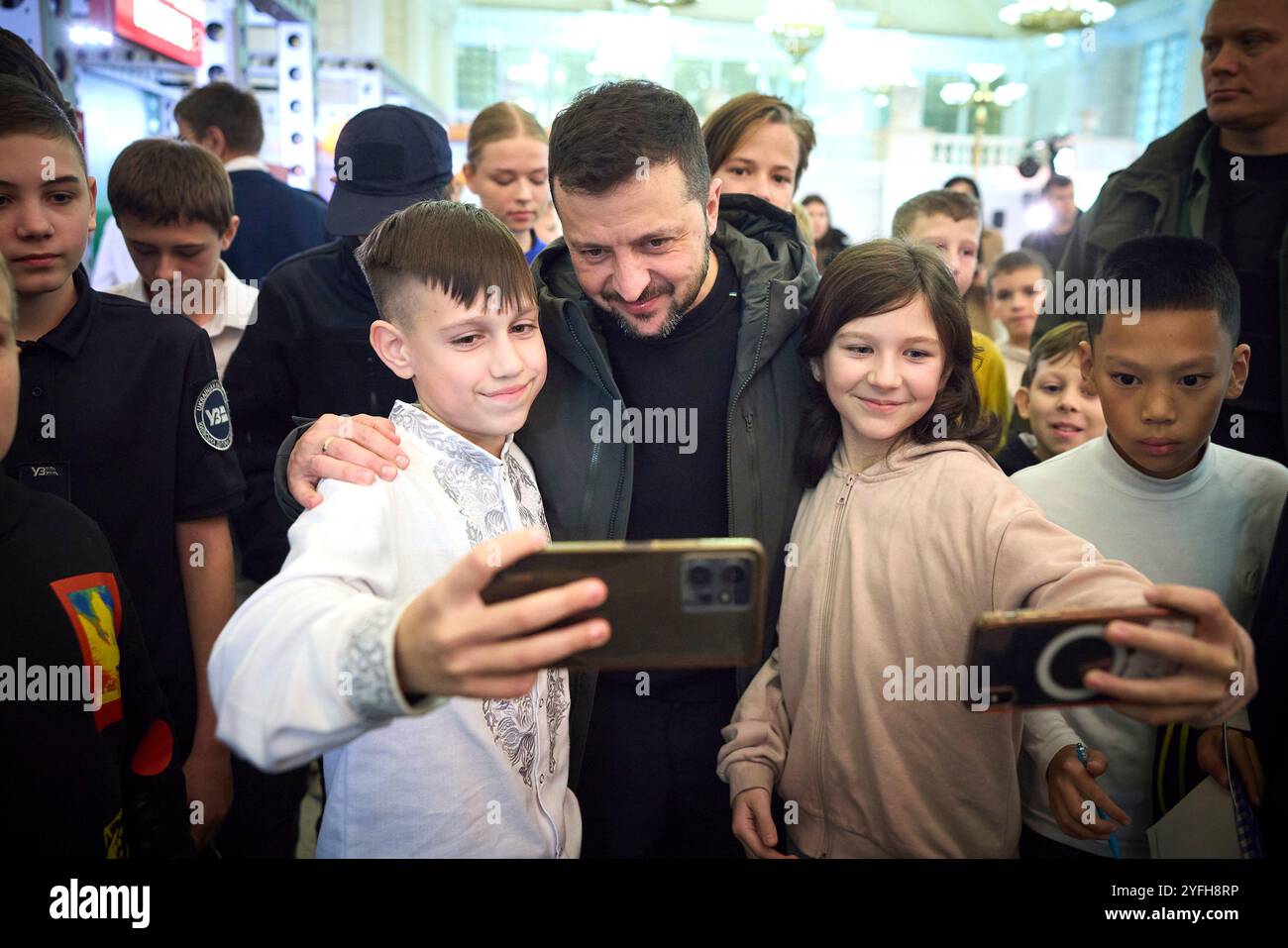 Kiev, Ukraine. 04th Nov, 2024. Ukrainian President Volodymyr Zelenskyy, takes a selfie with ...