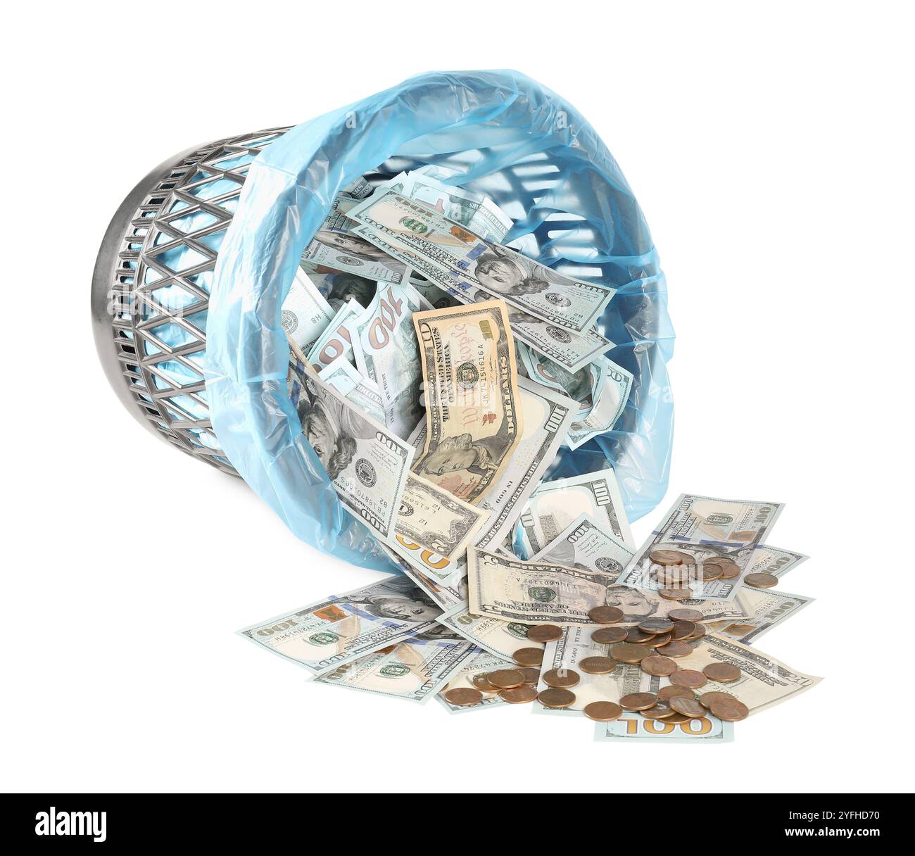 Many dollar banknotes, overturned trash bin and coins isolated on white ...
