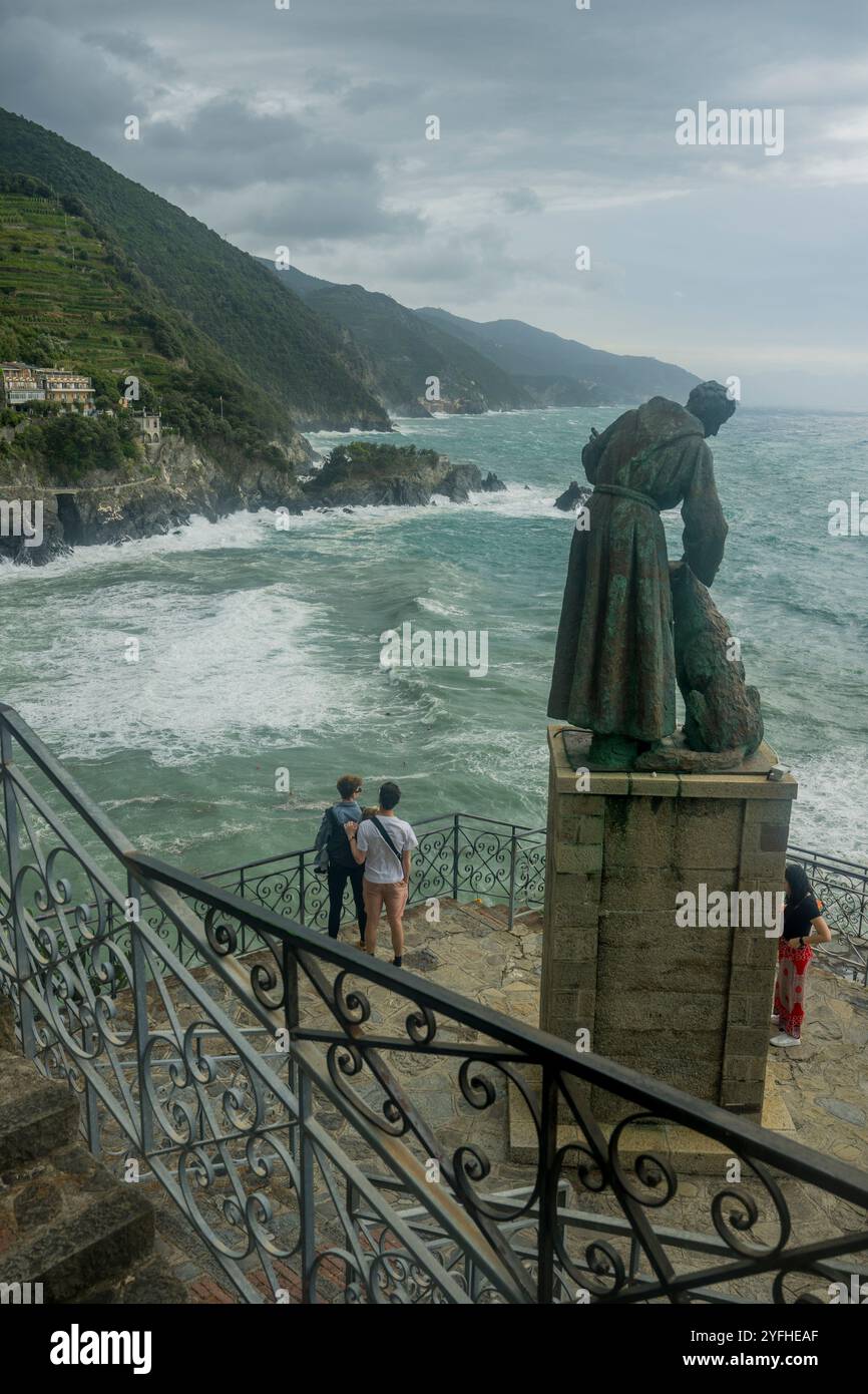 The statue of St. Francis at a rainy, stormy day near the Torre Aurora ...
