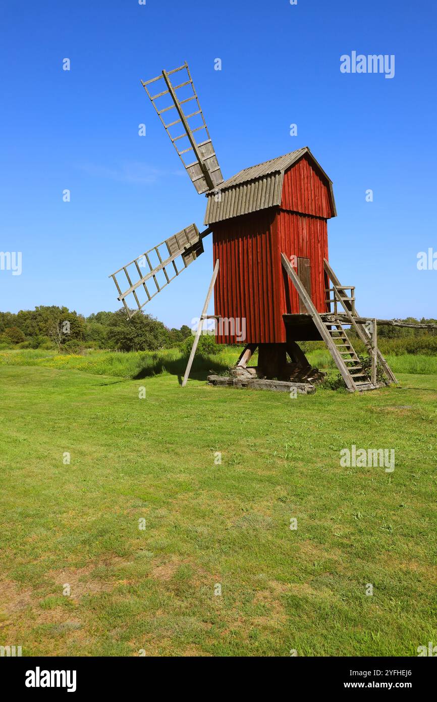 Traditional red painted windmill located in the Swedish province of ...