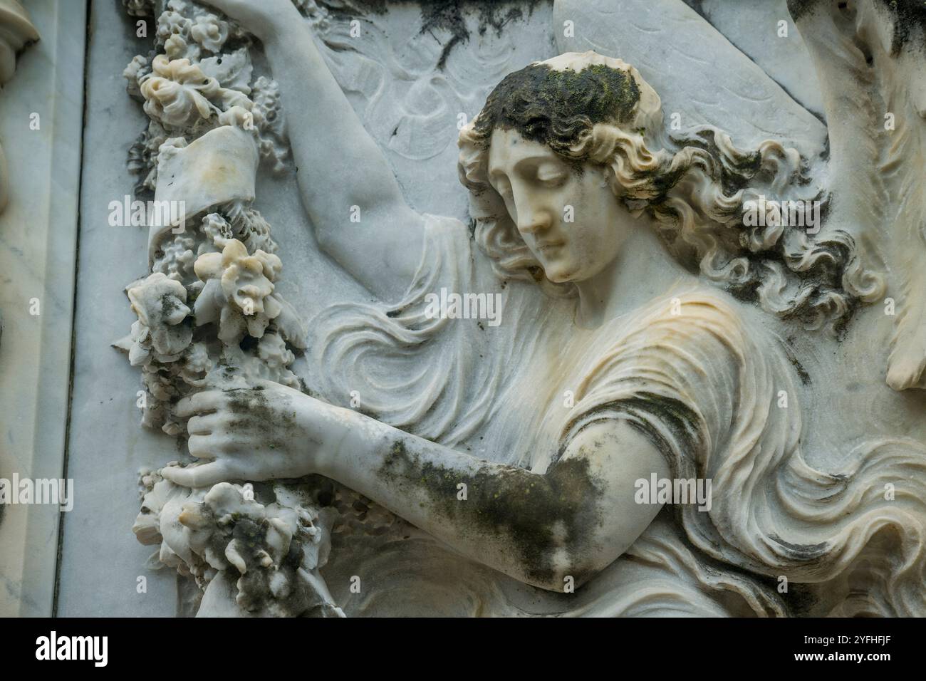 Elaborate stone carvings at a tomb of the cemetery next to the Church ...