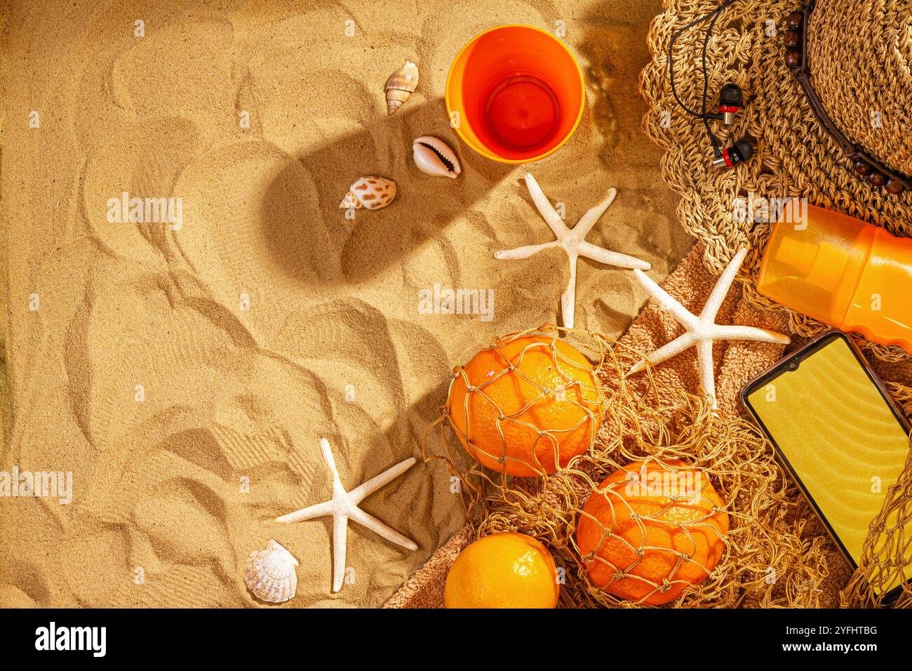 Concept of sandy beach holiday with accessories and fruit, top view ...