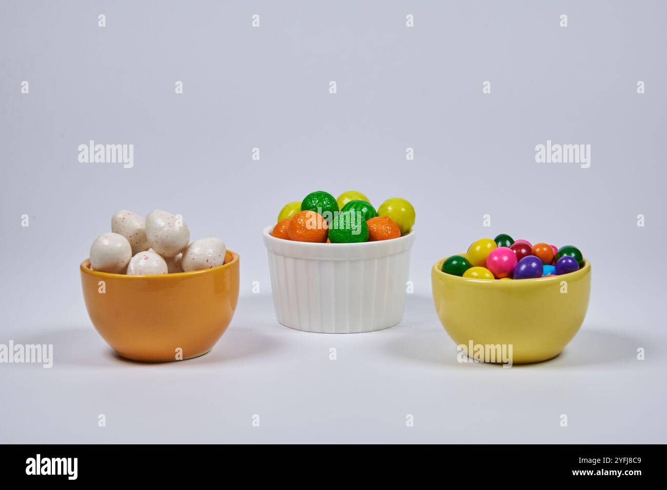 Gumballs of different colors and flavors representing fruits such as ...
