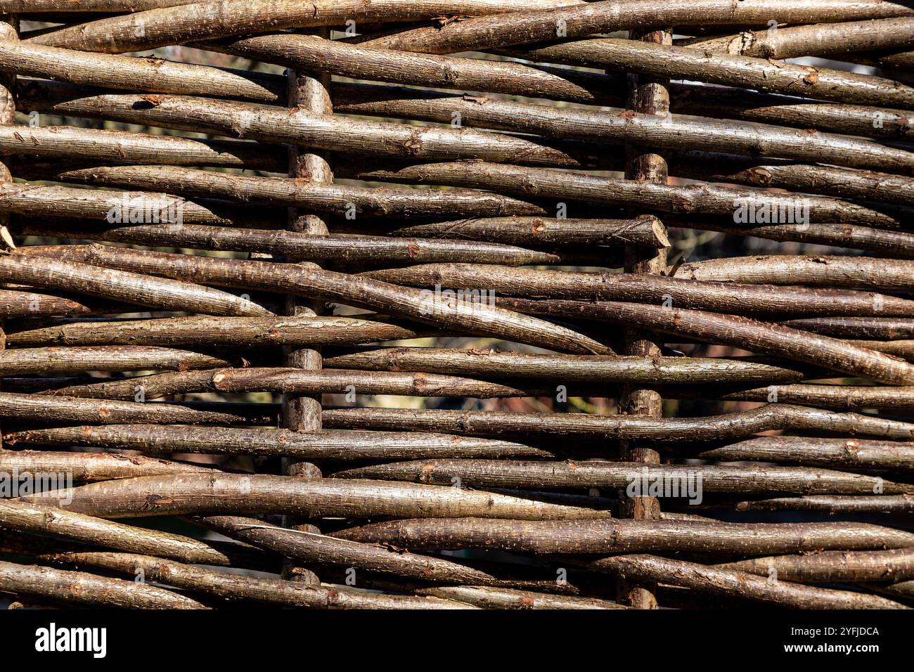Woven hazel hurdle fence close up Stock Photo - Alamy