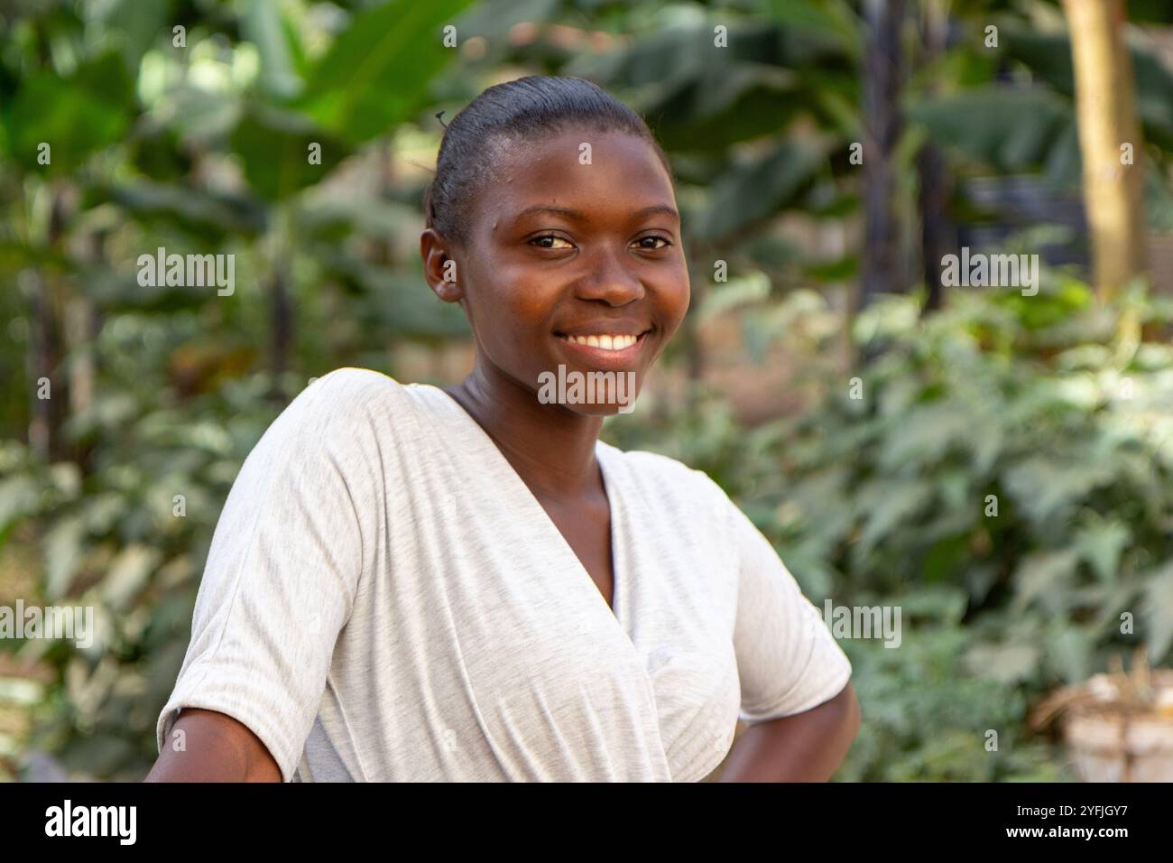 A young smiling Ugandan woman Stock Photo - Alamy