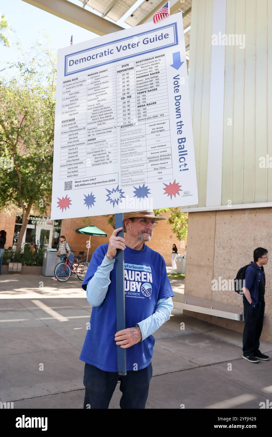 Tempe, USA. 04th Nov, 2024. A man walks around with a voter guide ...
