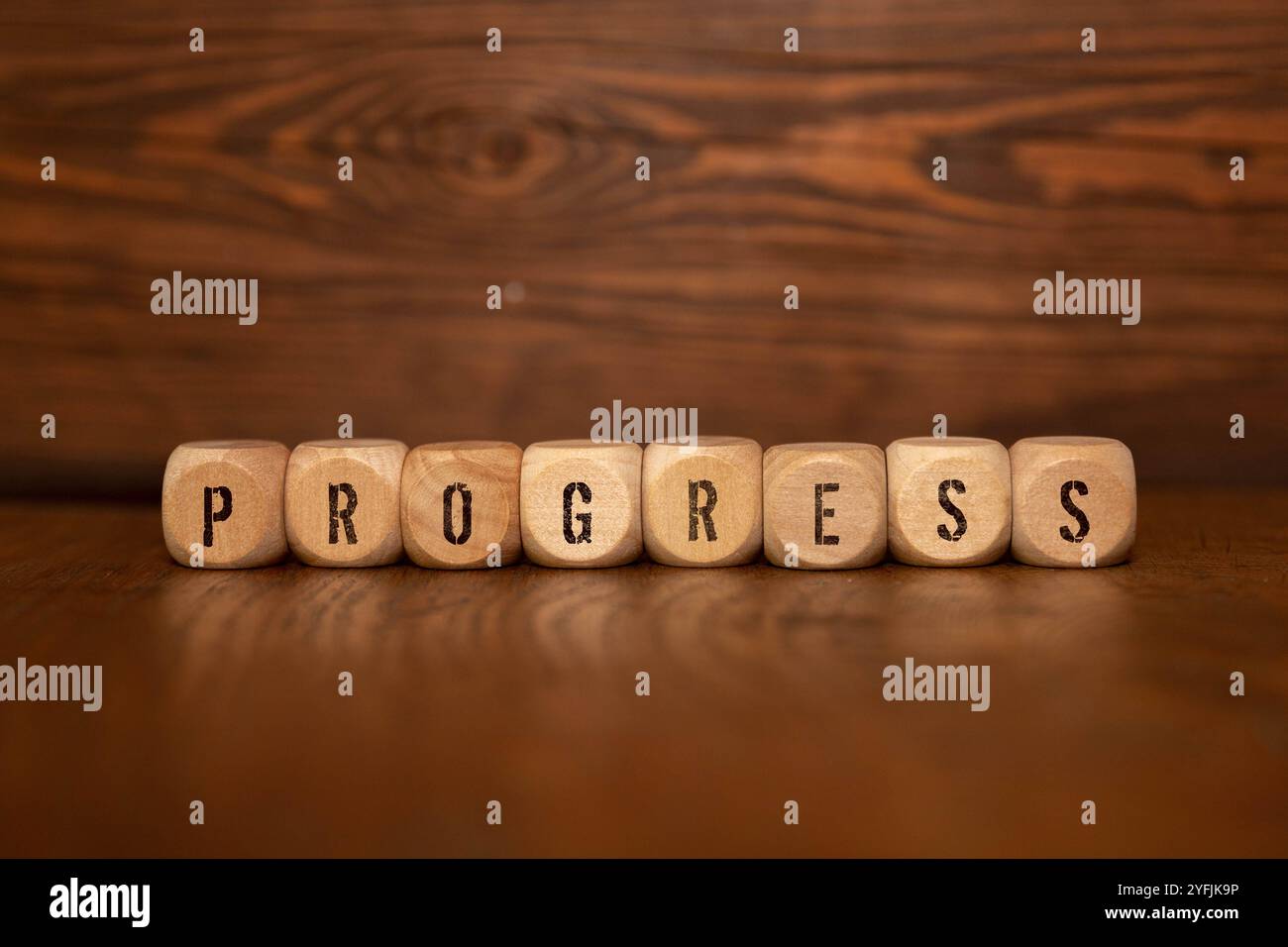 A conceptual image featuring wooden blocks spelling out the word ...